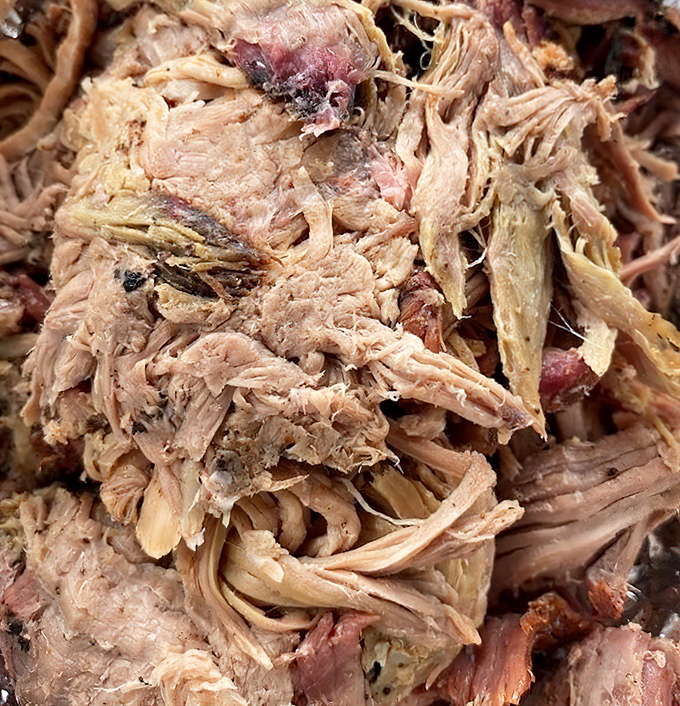 Pulled pork that actually looks hand-pulled, not machine-shredded. Those bark bits are like finding treasure in every bite.
