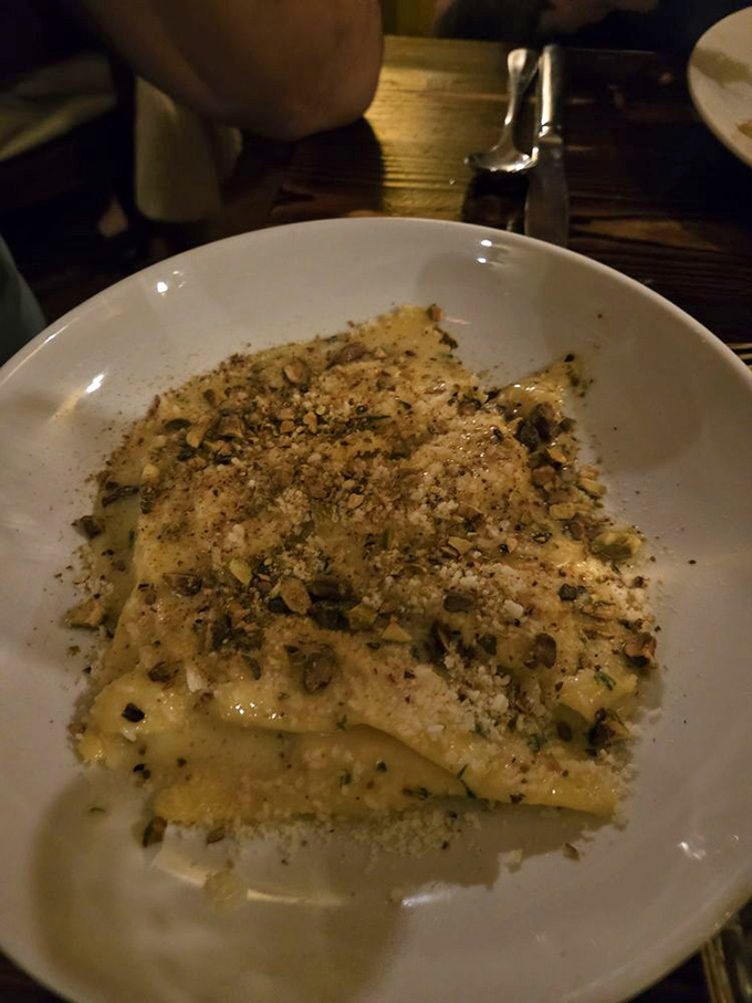 These ravioli aren't just pasta—they're little pillows of possibility, dusted with nuts and herbs that transform each bite into a mini vacation to central Italy.