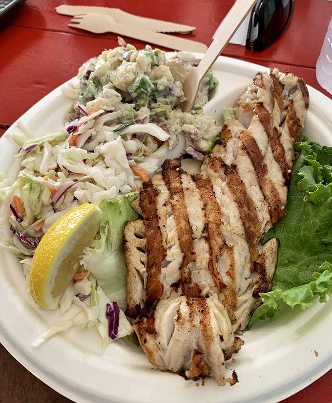 Grilled red snapper so perfectly prepared it could make a seafood skeptic switch teams. The grill marks are like nature's seal of approval.