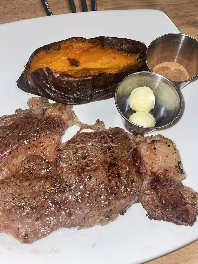 A steak and sweet potato combo that's the culinary equivalent of finding front-row concert tickets in your birthday card. Simple perfection on a white plate.