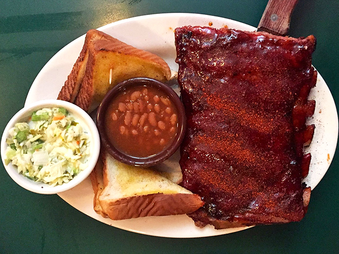 Ribs that have achieved barbecue nirvana &ndash; perfectly glazed, served with Texas toast and sides that know their supporting role in this meaty drama.