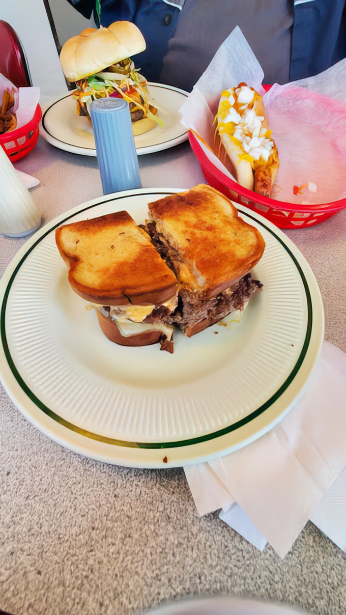 This Reuben sandwich isn't just lunch&mdash;it's a skyscraper of flavor with layers of corned beef, Swiss, and sauerkraut reaching for the heavens.