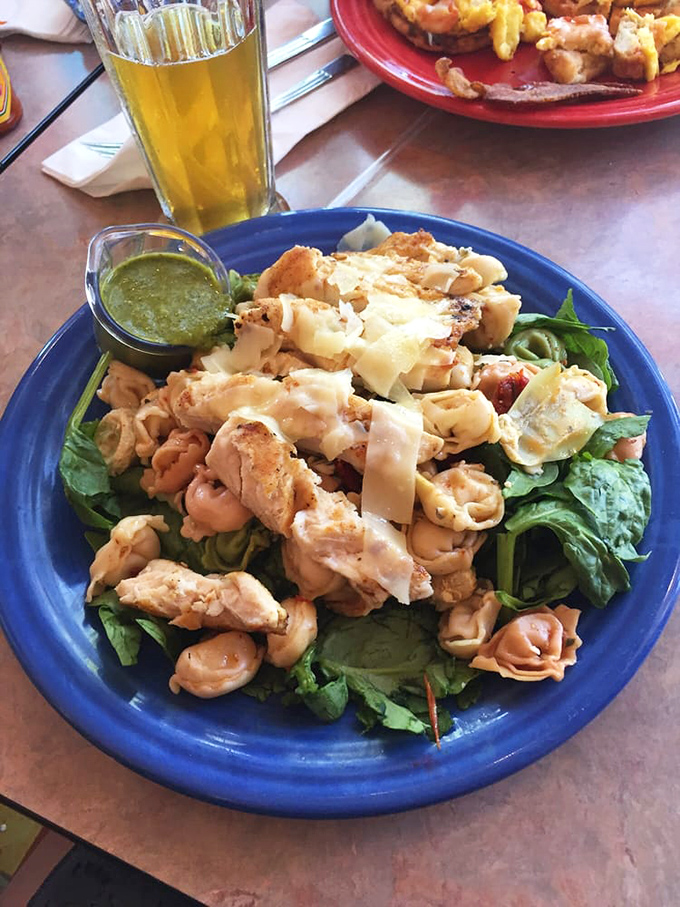 Not all heroes wear capes; some come as protein-packed salads on blue plates, proving Crest Cafe isn't just a one-trick breakfast pony.