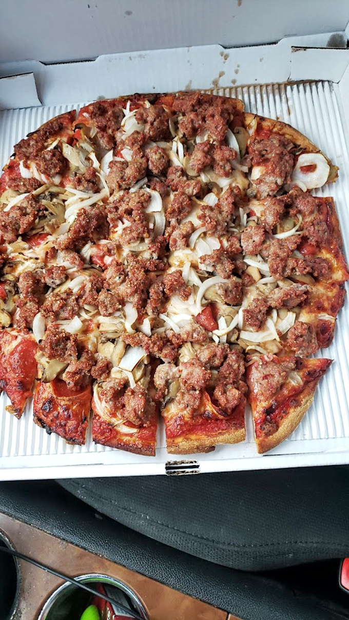 A beautiful marriage of sausage, onions, and mushrooms. This pizza doesn't need a passport to transport you straight to flavor paradise.
