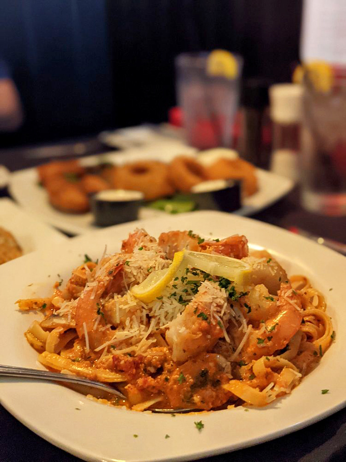 Pasta that doesn't just carry seafood&mdash;it celebrates it. Those shrimp look like they're doing a victory lap in that creamy sauce.