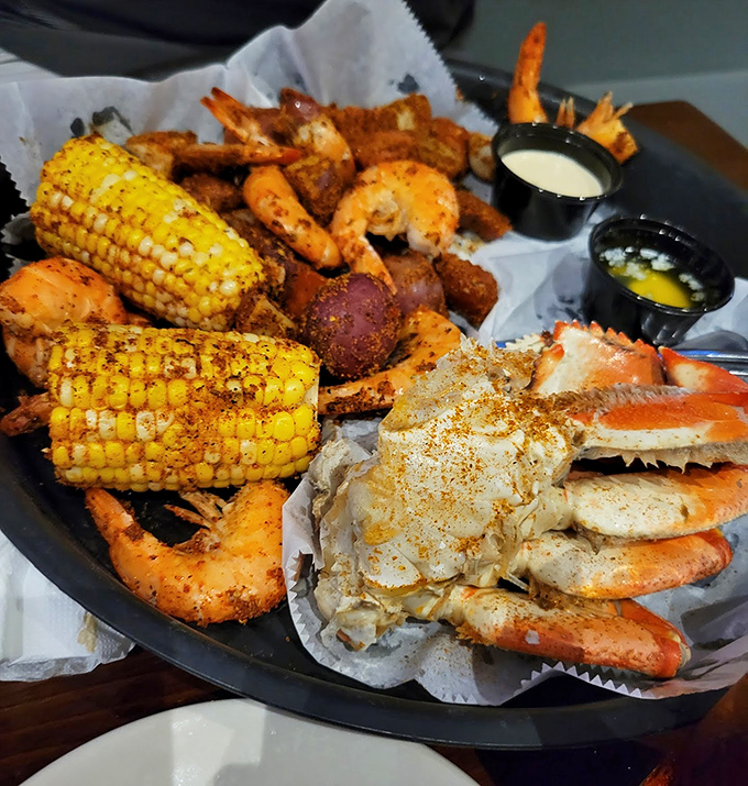 The seafood platter that makes inland diners forget they're hours from the coast&mdash;corn, crab legs, and shrimp creating a symphony of flavors.