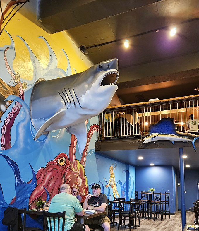 Where else can you dine beneath a shark while admiring an octopus? The playful marine decor makes every meal feel like an underwater expedition.