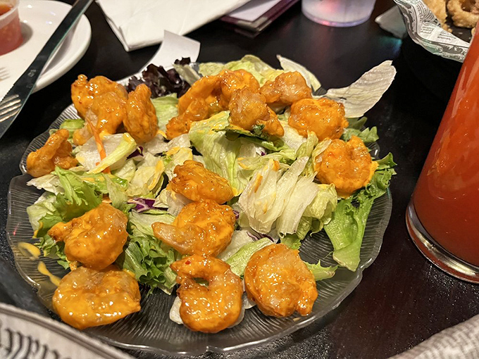 Buffalo-style shrimp perched atop crisp lettuce&mdash;proof that sometimes the best things in life come in small, sauce-covered packages.