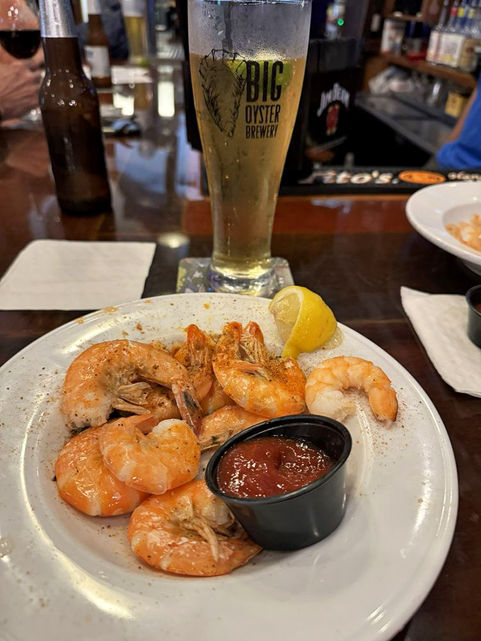 Peel-and-eat shrimp dusted with spices that dance on your tongue. Paired with a local craft beer, it's vacation in edible form.