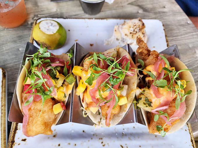 These fish tacos are dressed better than most wedding guests&mdash;vibrant mango salsa and pickled onions creating a fiesta in every bite.