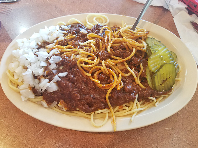 Spaghetti with meat sauce, diced onions, and pickles on the side. Midwest diner pasta doesn't follow Italian rules, and that's exactly why we love it.