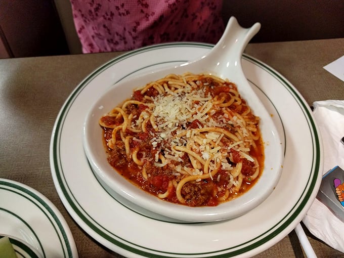 Spaghetti and meatballs that would make any Italian grandmother nod in approval. That dusting of parmesan isn't just garnish—it's the final blessing.