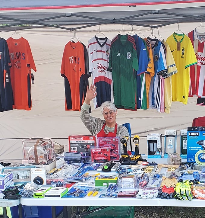 Soccer jerseys from around the world create a colorful backdrop for this vendor's impressive array of tools and household gadgets.