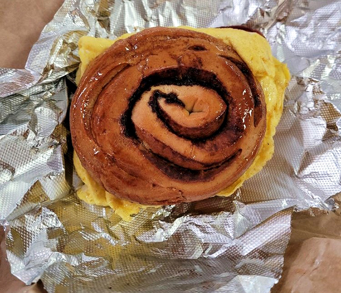 One glorious cinnamon stick bun, perfectly spiraled and glazed, ready to transport you straight to breakfast heaven with every bite.