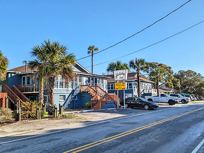 The Holiday Inn sign beckons travelers to extend their stay. In Folly Beach, even the motels seem to whisper, "Why rush back to reality?"