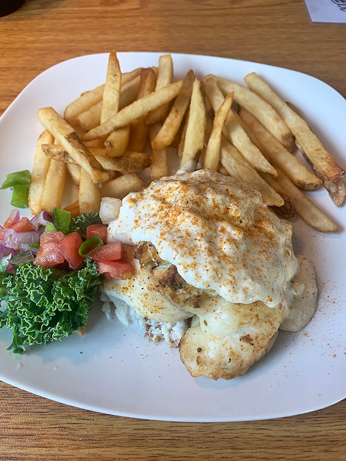 Seafood magic: a perfectly cooked fish smothered in creamy crab topping. Diet plans come here to die, and nobody's complaining. 