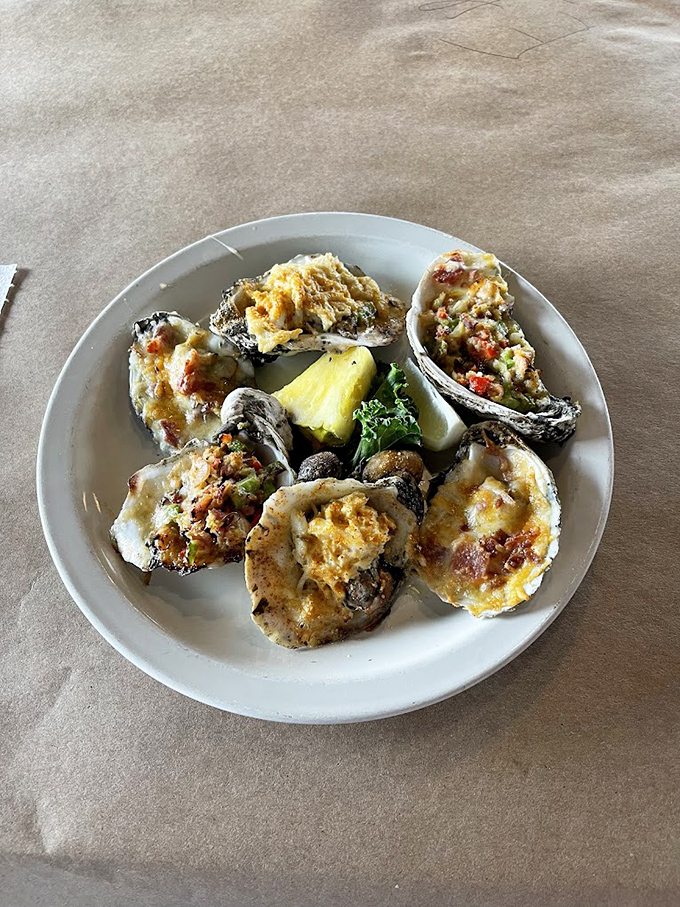 Oysters wearing their Sunday best. These stuffed beauties are dressed to impress with toppings that complement rather than overwhelm their briny charm.