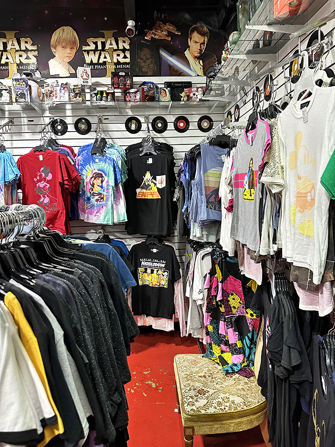 Star Wars meets streetwear in this corner of pop culture paradise. Vinyl records serve as galactic decorations above shirts that scream "collector's item."