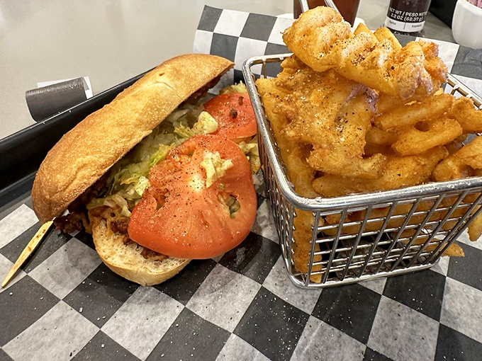A sandwich that doesn't need to be complicated to be delicious, paired with fries that deserve their own special wire basket throne.