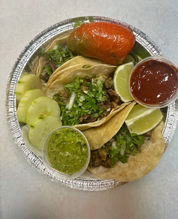 Authentic street tacos with all the fixings. That lime wedge isn't decoration&mdash;it's the magic wand that transforms good tacos into great ones.