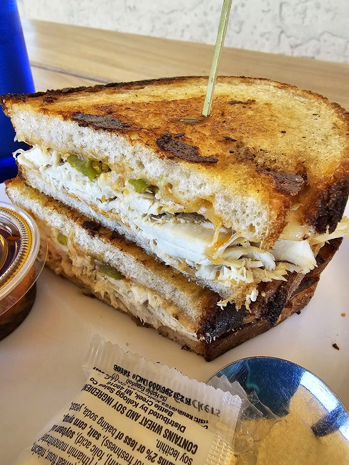 Golden-grilled comfort meets oceanic elegance in this sandwich that redefines the classic American tuna melt experience. 