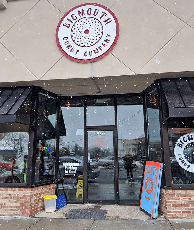Even in winter's grip, Bigmouth's welcoming entrance promises warmth, comfort, and the sweet embrace of handcrafted donuts inside.