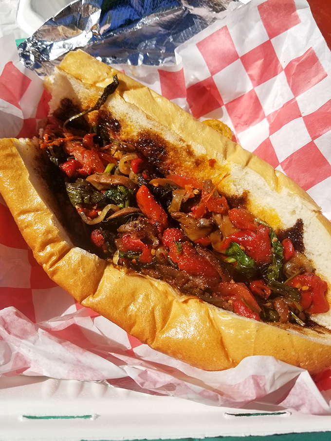 Fresh veggies and rings of onion piled high on crusty bread. Proof that sometimes the simplest combinations create the most memorable meals.