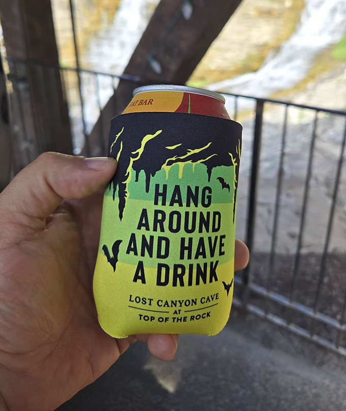 This cheerful koozie reminds you to "Hang Around and Have a Drink" in cave style.