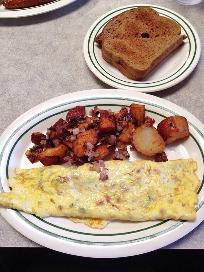 This Western omelet and home fries combo isn't just breakfast; it's a declaration that mornings deserve respect and proper seasoning.