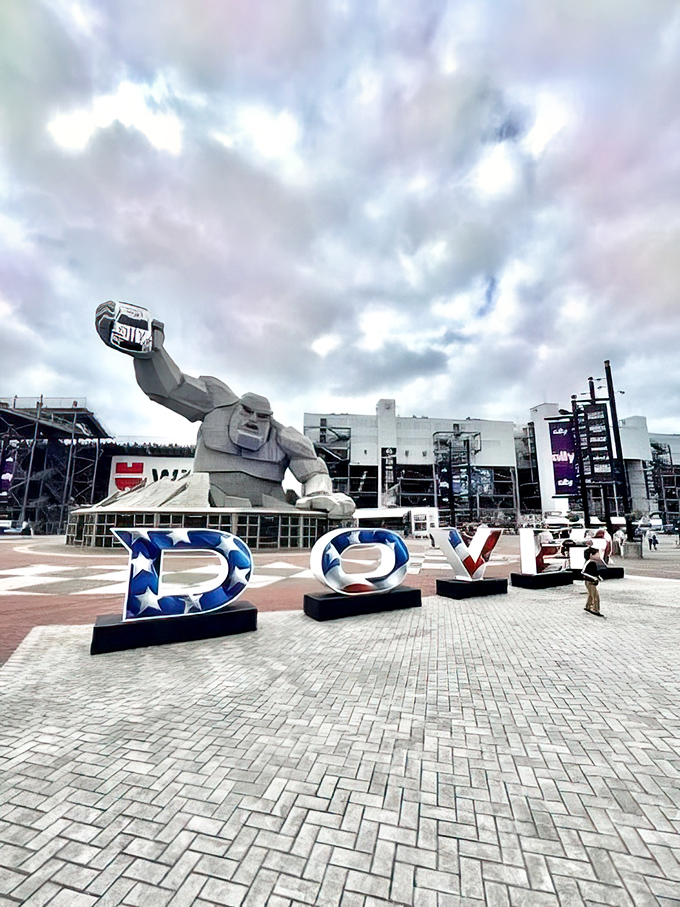 The Monster Monument features tributes to racing legends like Richard Petty, creating a hall of fame that's literally watched over by a giant.
