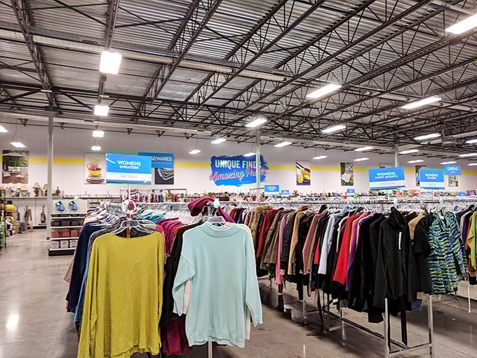 The women's clothing section stretches like a textile rainbow. Fashion archaeology where yesterday's splurges become today's steals.