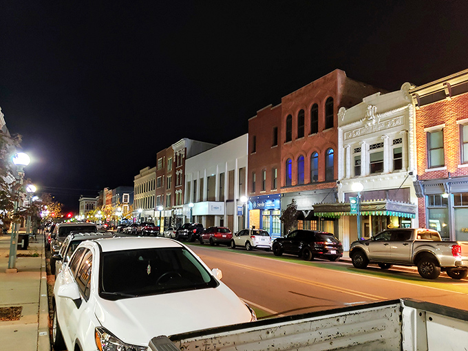 Adrian's downtown glows with warm light after sunset, its historic buildings housing affordable restaurants and shops for budget-conscious residents.