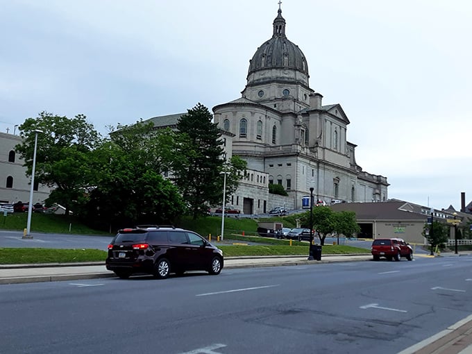 Cathedral spires pierce skies above communities where faith and frugality walk hand in hand.
