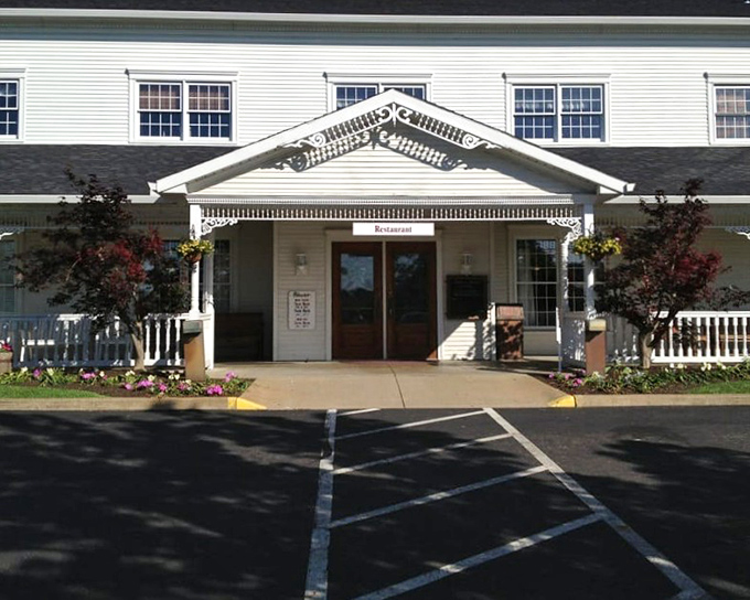 The Amish Door's stately white entrance stands like a temple to good eating. Columns that could support both architecture and your post-meal satisfaction.