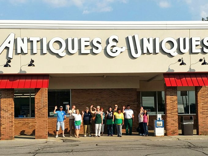 Bright "Antiques & Uniques" signage welcomes enthusiastic shoppers. The name promises both familiar comforts and surprising discoveries!