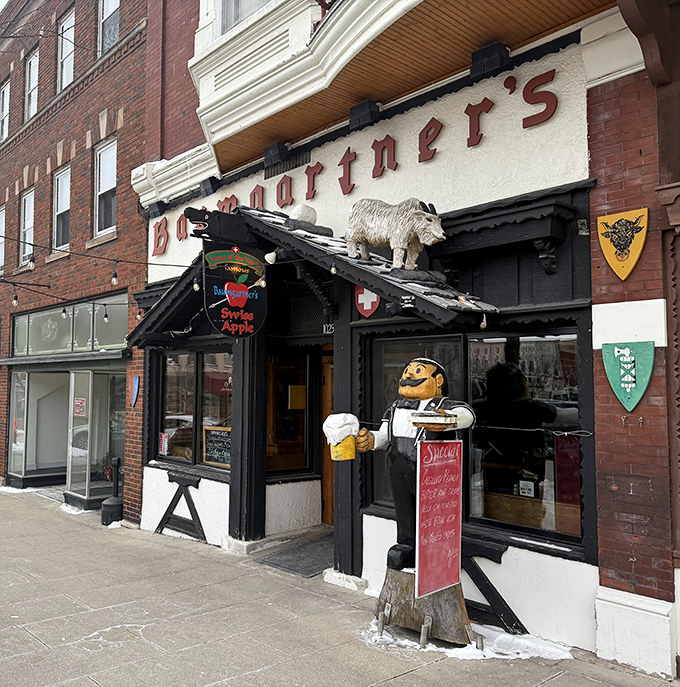 When your greeter is a wooden mustachioed server with a tray, you know you're in for a sandwich experience, not just lunch.