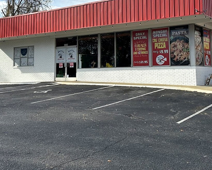 Bussin Pizza might hide in a strip mall, but that red awning signals serious pizza business inside.