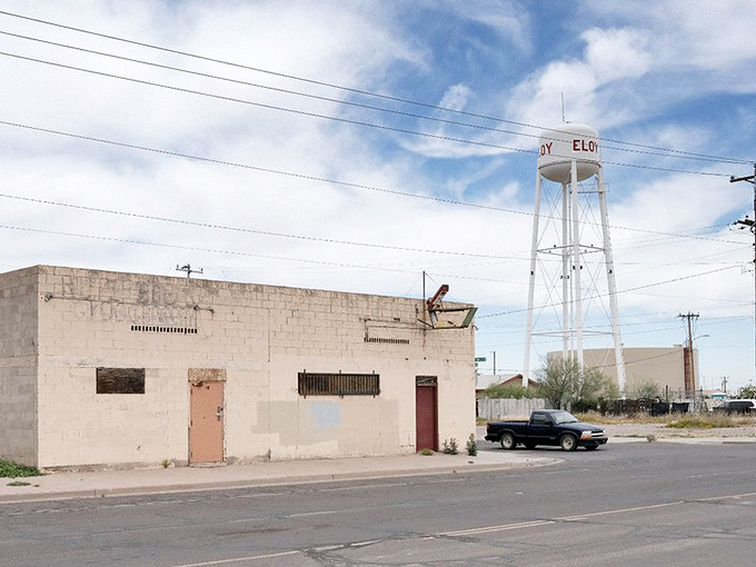 Eloy's water tower punctuates the desert sky, a landmark for this small town between two cities.