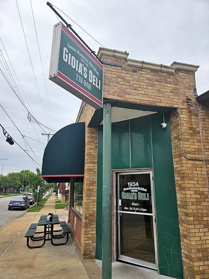 Gioia's green awning and brick facade hide a century of sandwich-making wisdom and hot salami secrets.