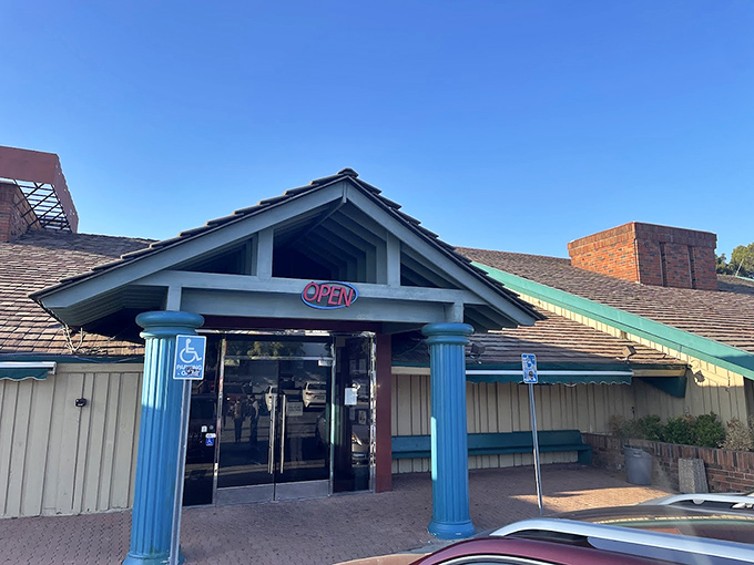 Those blue columns stand like sentinels guarding a seafood kingdom. Unassuming entrance, unforgettable experience!