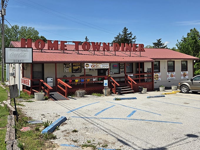 Home Town Diner's bright red sign is like a friendly wave, beckoning hungry travelers to pull over for a slice of small-town charm.