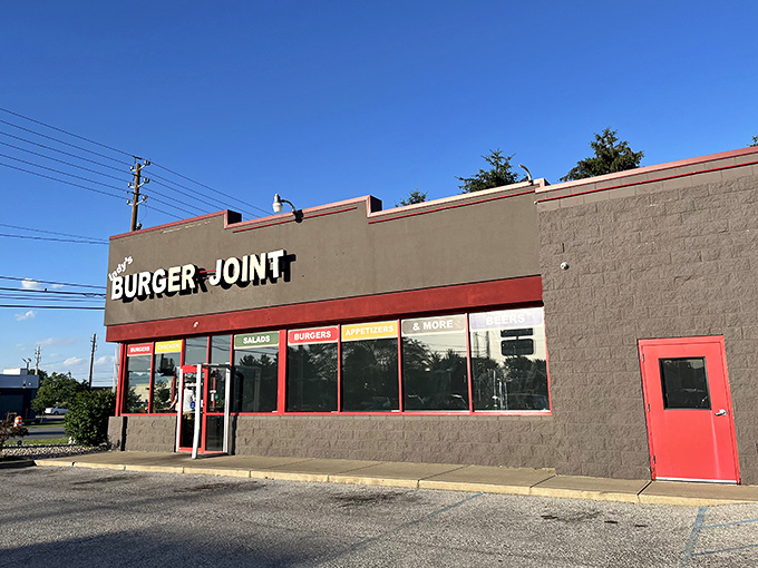 Indy's Burger Joint's original location sports a no-nonsense exterior. That gray building with red trim houses burger magic within.
