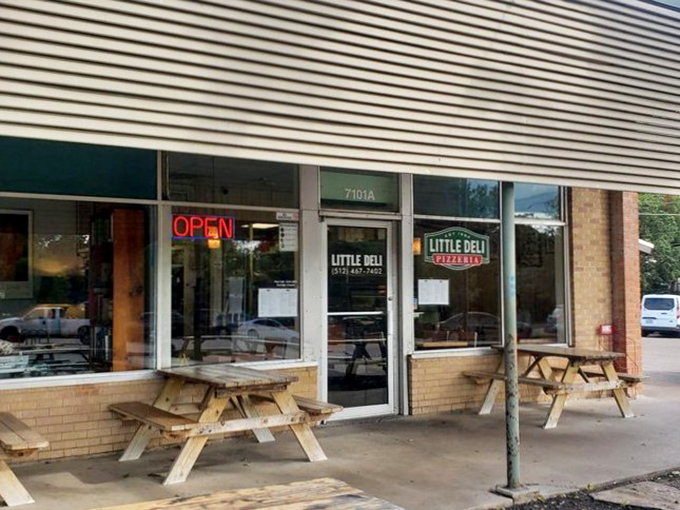 Little Deli's humble exterior and picnic tables create the perfect setting for sandwich magic in Austin's Crestview neighborhood.
