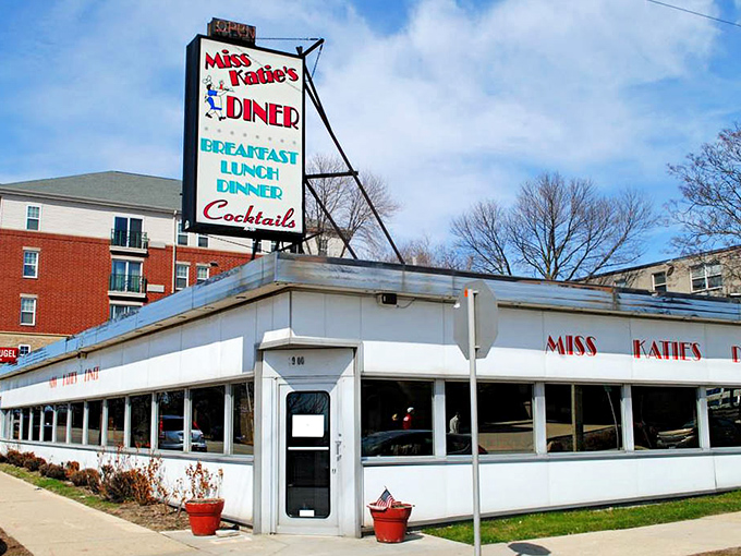 Miss Katie's classic white diner crowned with Lady Liberty—because freedom means breakfast served all day long.