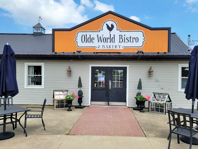 That bright orange sign against the neutral building is like a beacon calling to hungry travelers – "Deliciousness this way!"