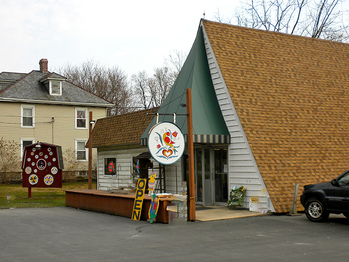 A charming A-frame shop with a colorful hex sign beckons visitors to explore Pennsylvania Dutch folk art treasures.