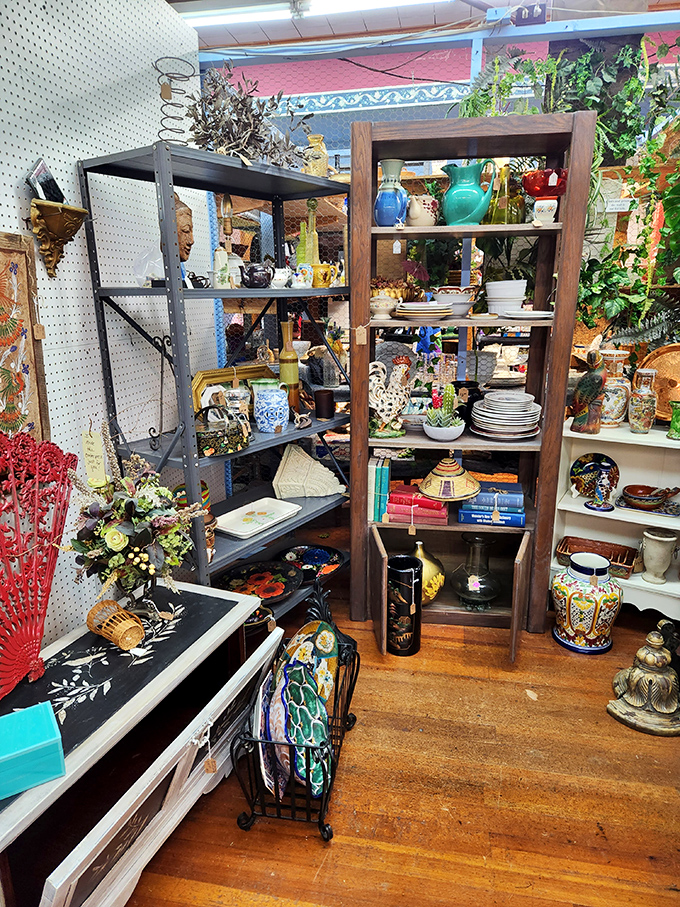 This charming display showcases the art of curation, where pottery and paintings create a gallery experience at flea market prices.