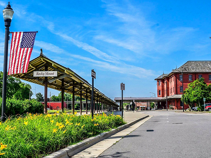 Visit this historic train station to see the classic red brick architecture and bright yellow flowers blooming under blue skies.