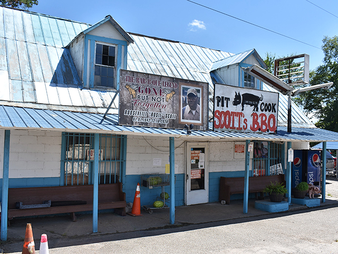 That weathered blue tin roof has sheltered generations of BBQ pilgrims seeking the holy grail of whole hog cooking.