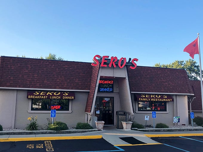Sero's bright red sign pops against the brick building, promising family restaurant comfort in neon-lit glory.